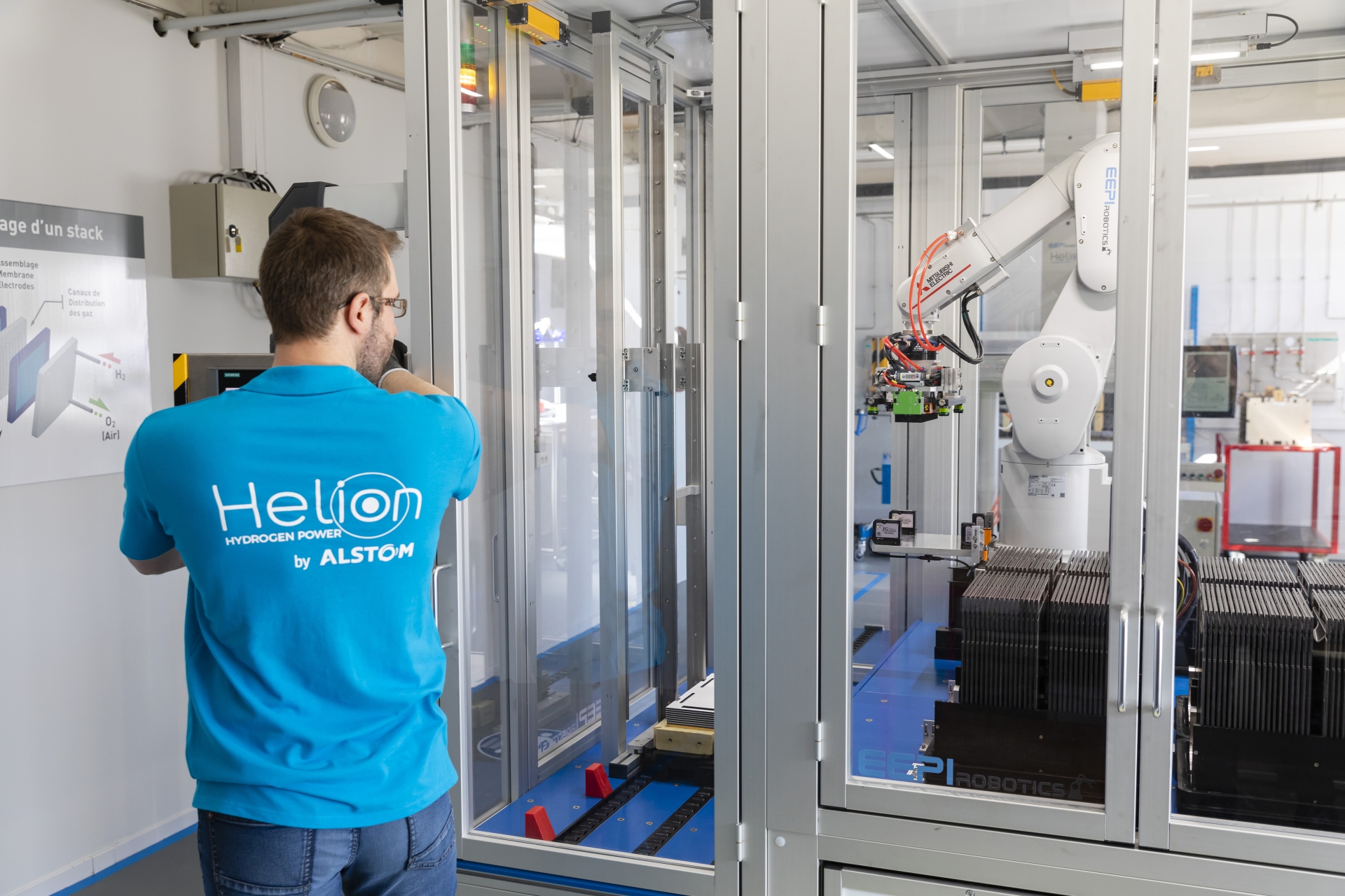 Robot assembly stacks assembly line fuel cell systems. | Helion